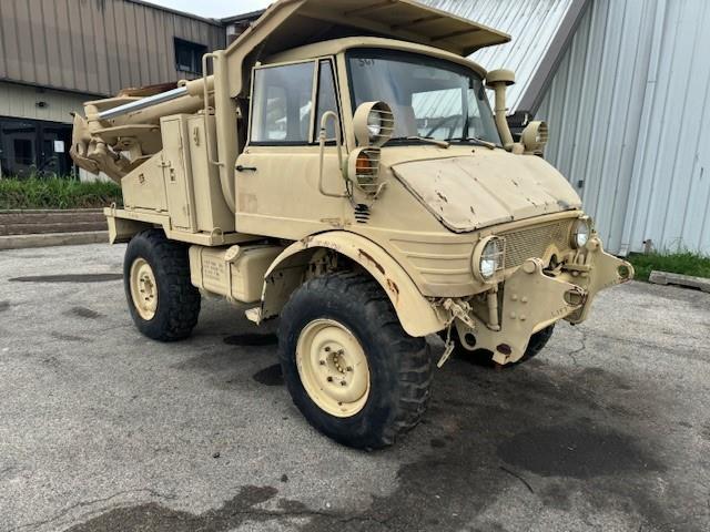 Freightiner Unimog FLU419 with Front End Loader and Rear Case Backhoe ...