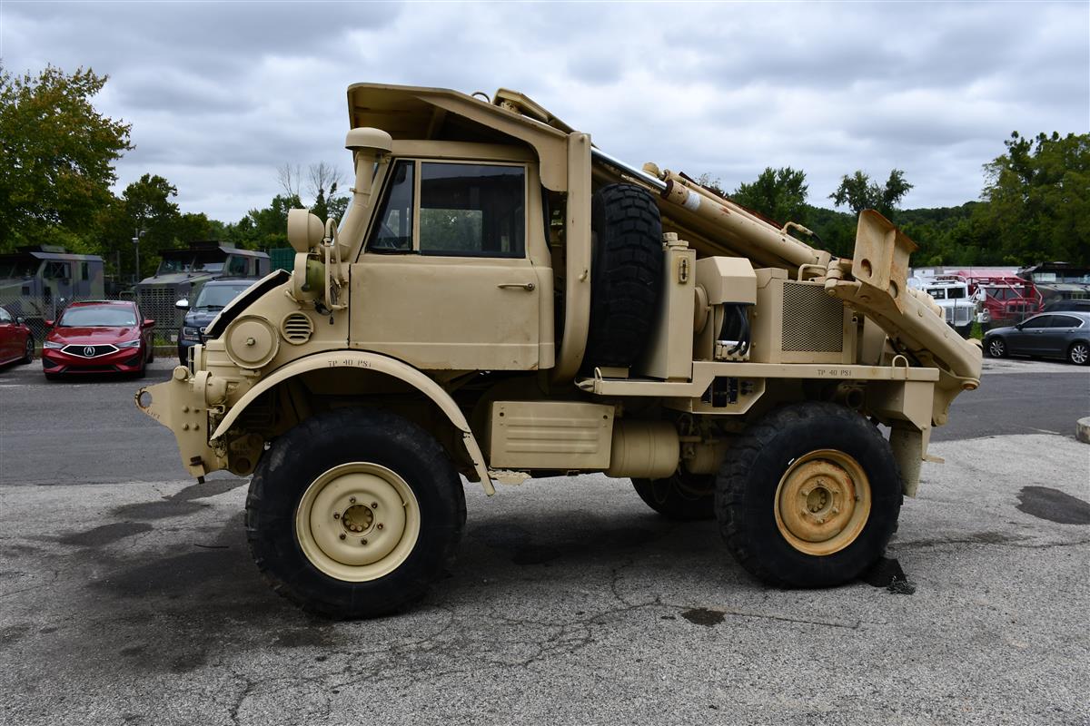 Freightiner Unimog FLU419 with Front End Loader and Rear Case Backhoe ...
