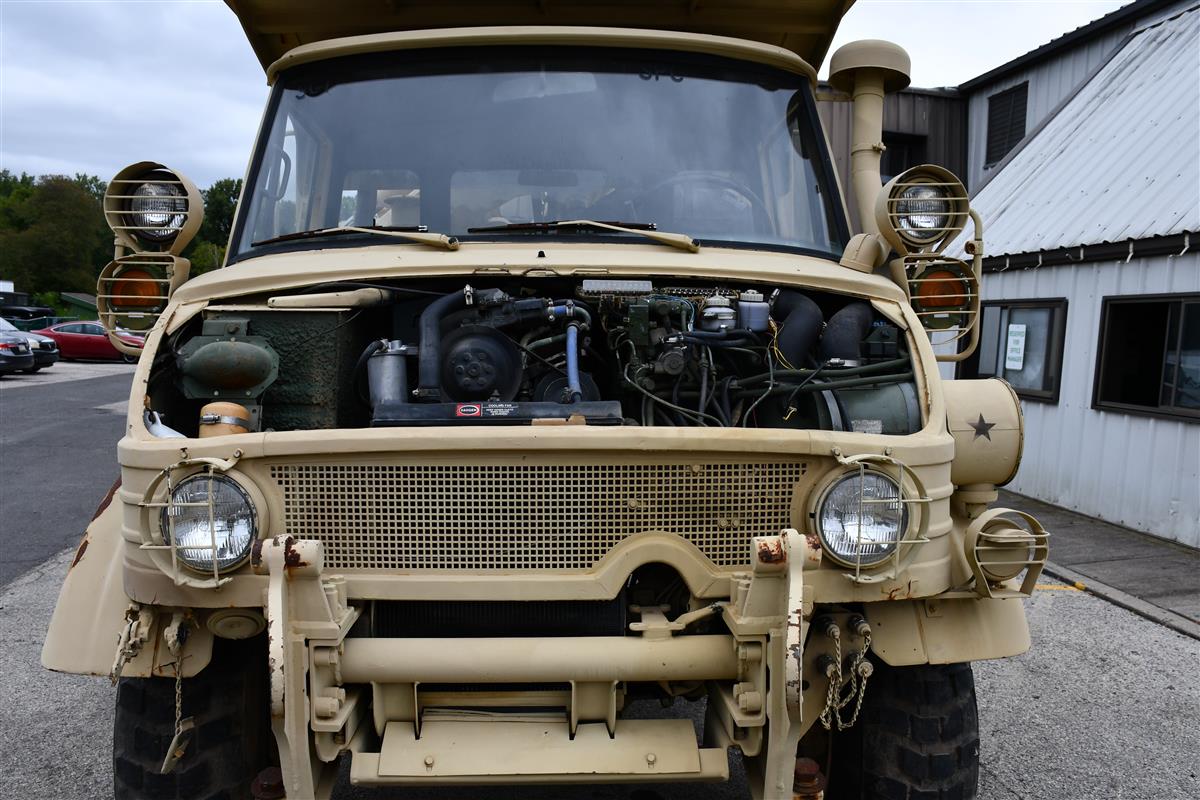 Freightiner Unimog FLU419 with Front End Loader and Rear Case Backhoe ...