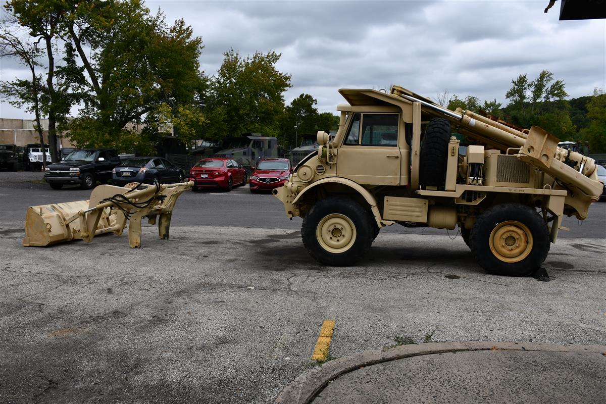 Freightiner Unimog FLU419 with Front End Loader and Rear Case Backhoe ...